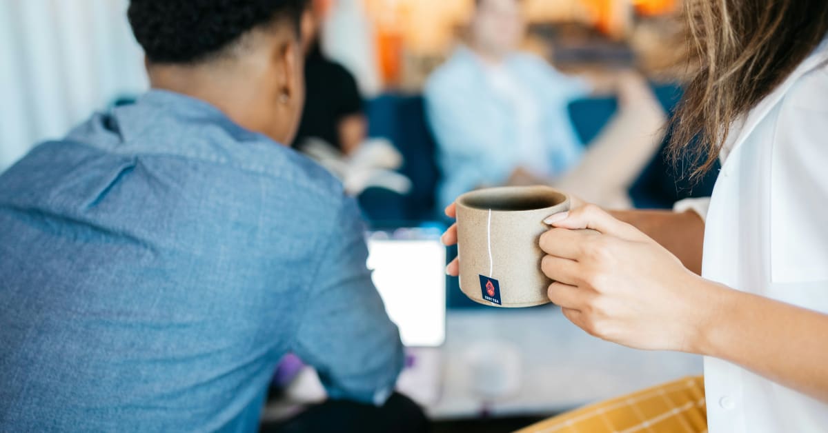 What is coffee badging? The hybrid work buzzword explained - TheStreet