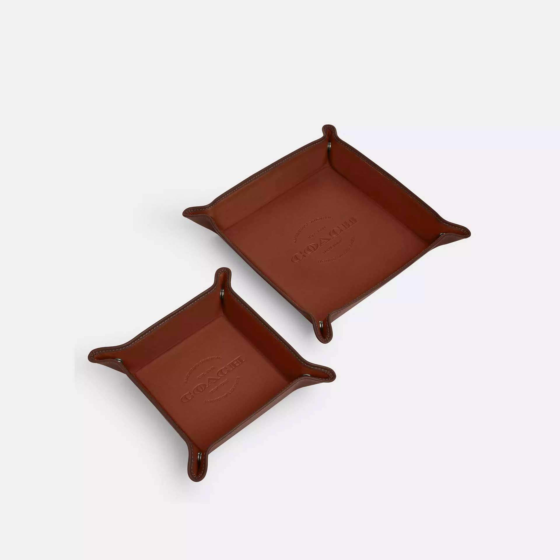 Coach Outlet is selling a $250 set of leather trays for $75 - TheStreet