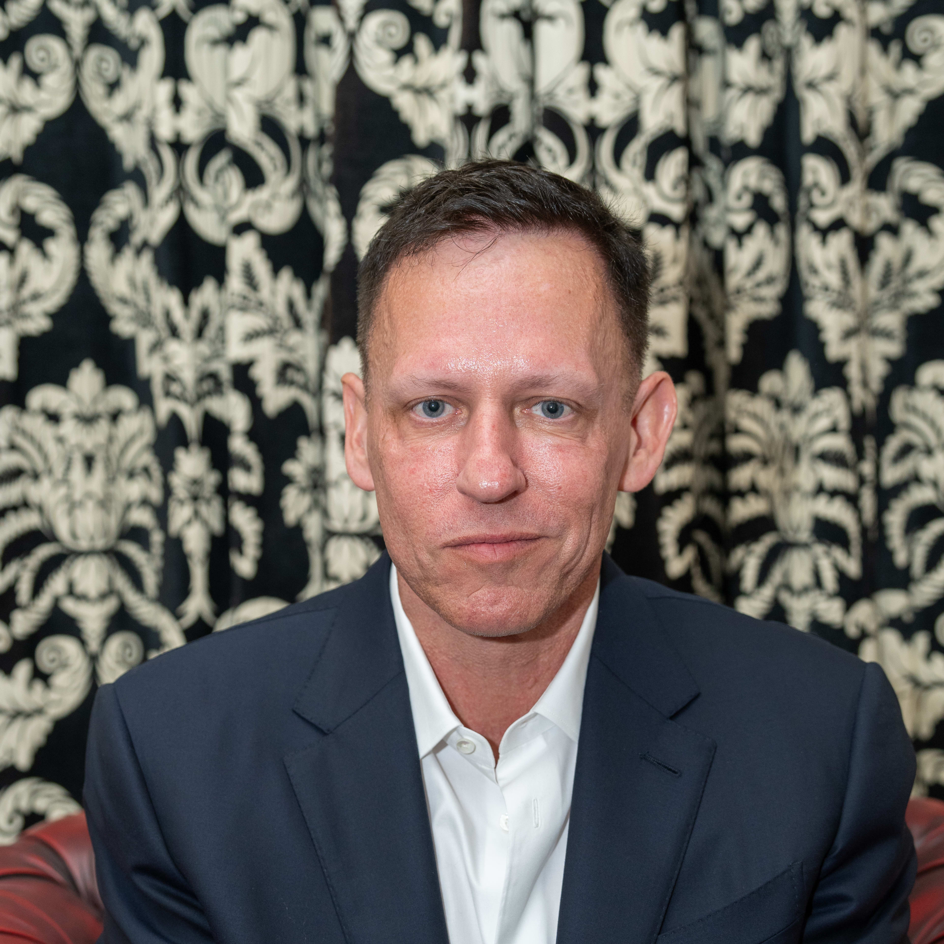 Rivian founder RJ Scaringe’s net worth & CEO salary in 2025 - TheStreet